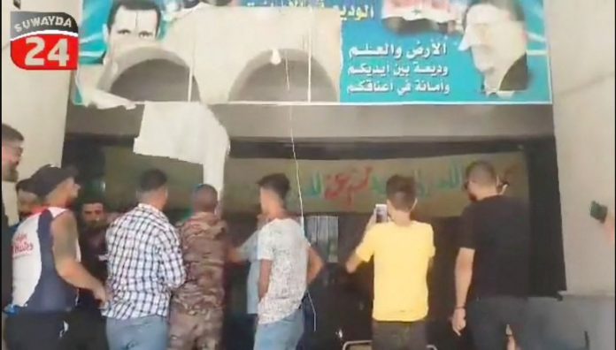 Syrians tear down poster of Assad in Sweida as protests swell – The ...